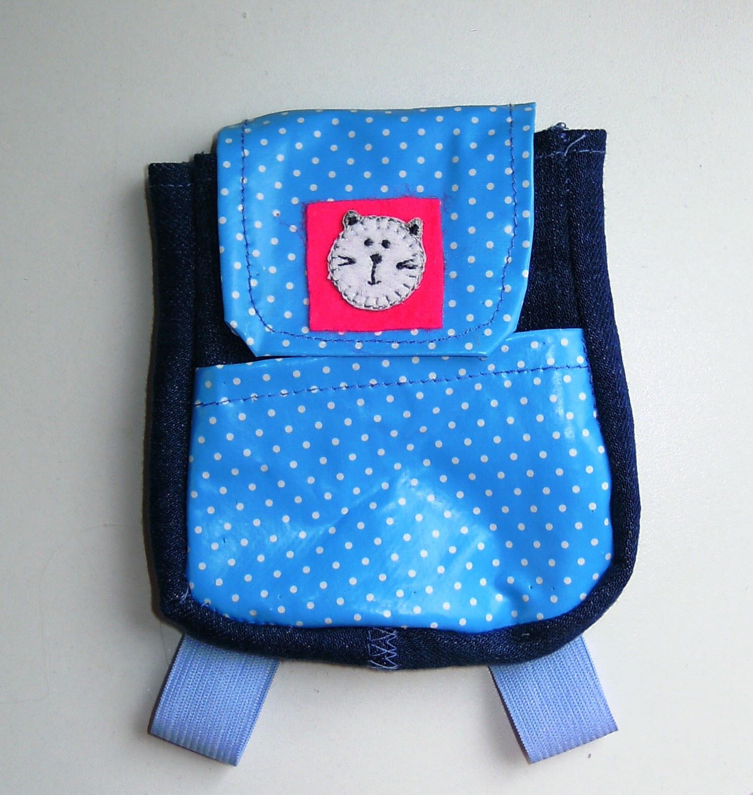 Doll's backpack in blue denim and blue spotted vinyl with elastic back ...