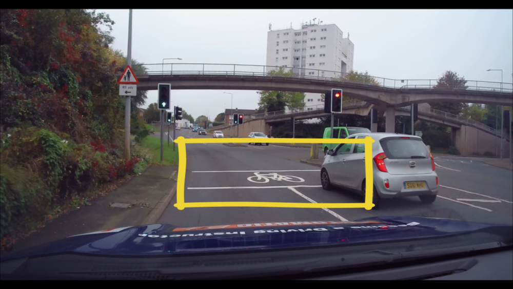 Driving lessons teaching a pupil to deal with traffic lights in the uk