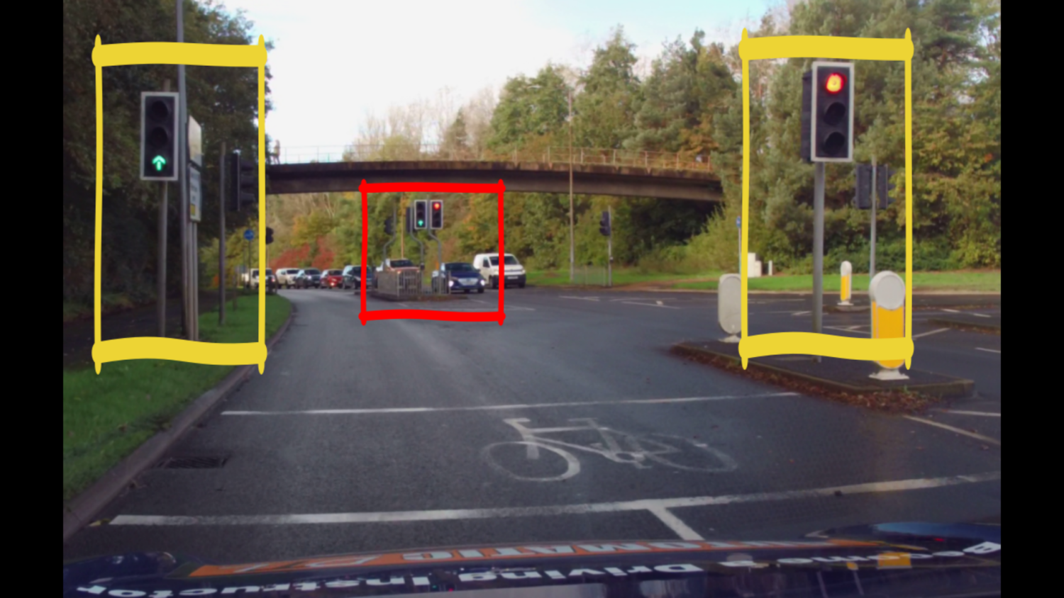 Driving lessons teaching a pupil to deal with traffic lights in the uk