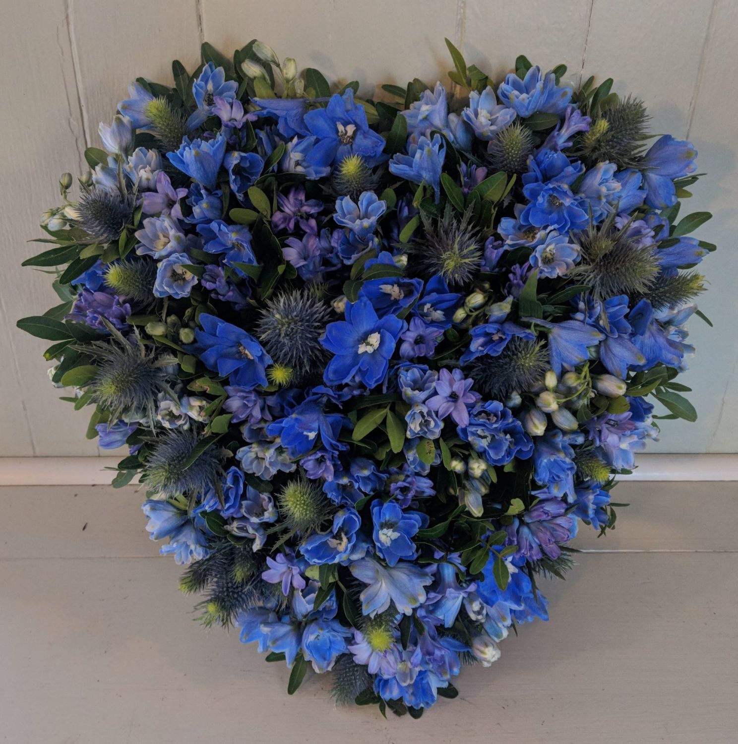 Send rose and freesia heart funeral flower tributes to Sussex