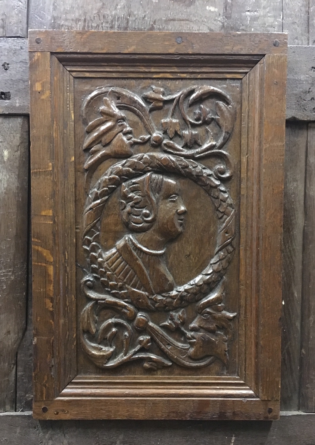 16th century carved oak romayne profile panel