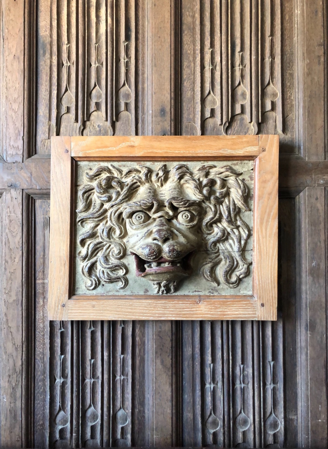 17th century carved oak Lion head panel.