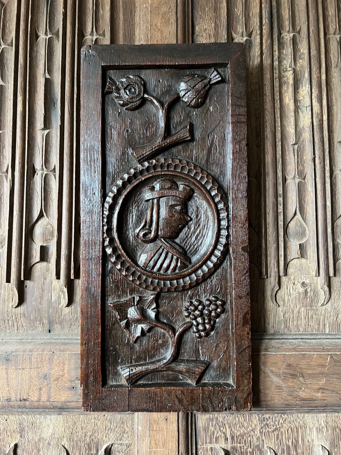 16th century carved oak romayne profile panel