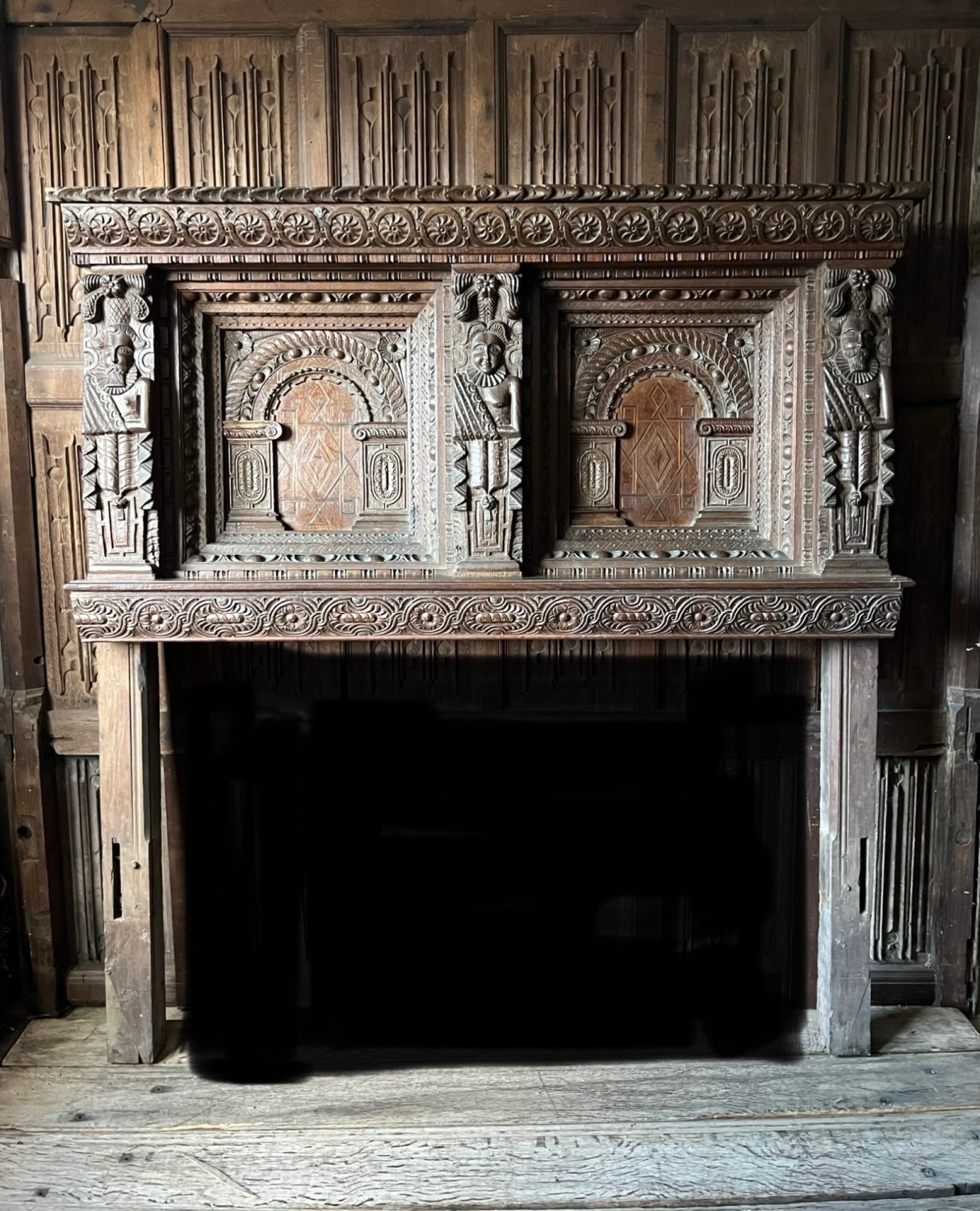 elizabethan carved oak headboard.