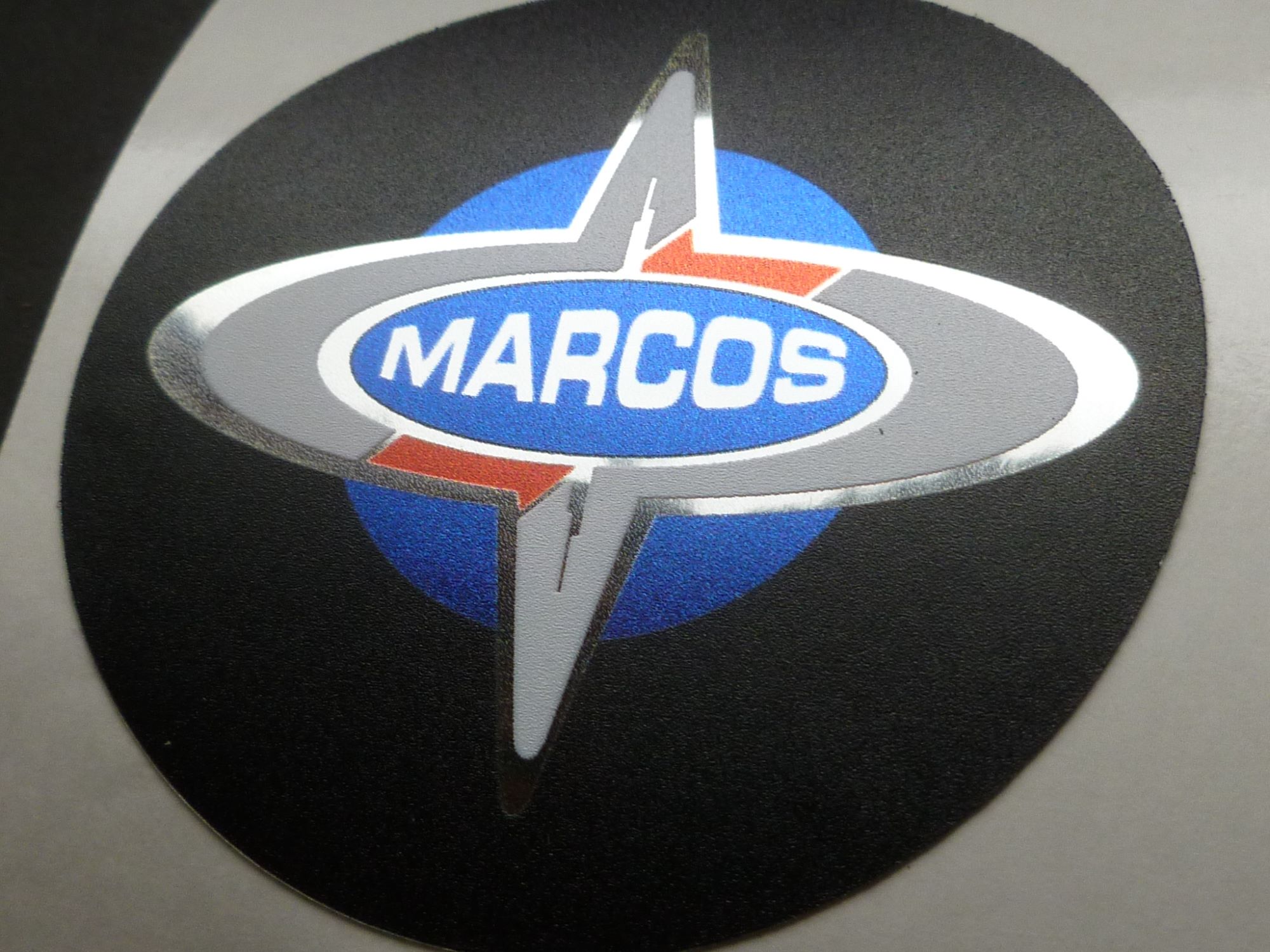 Marcos Logo Shaped Stickers. 1" or 2" Pair.