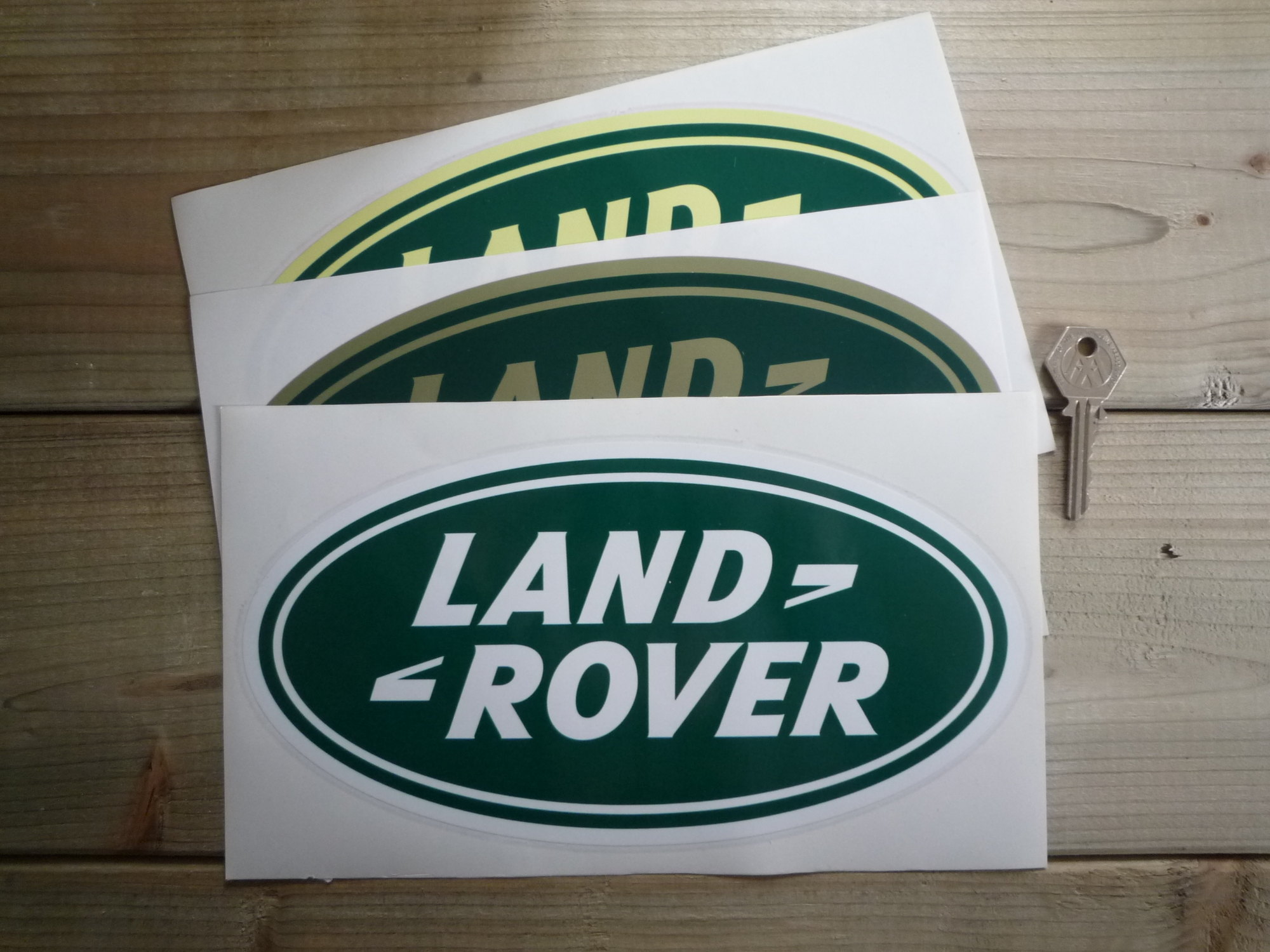 Land Rover Silver with Green or Black logo Circular Stickers. 68mm Pair.