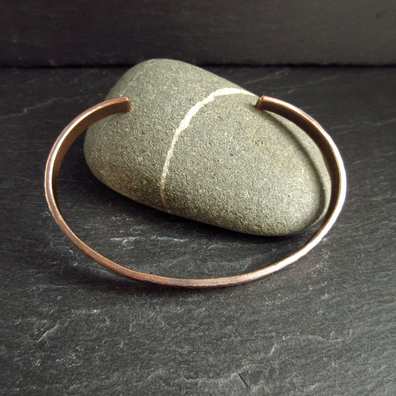 Handmade sterling silver and copper cuff bracelets