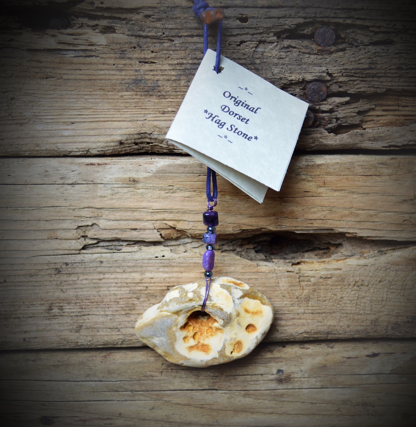Hag Stone Charm with Charoite Crystal