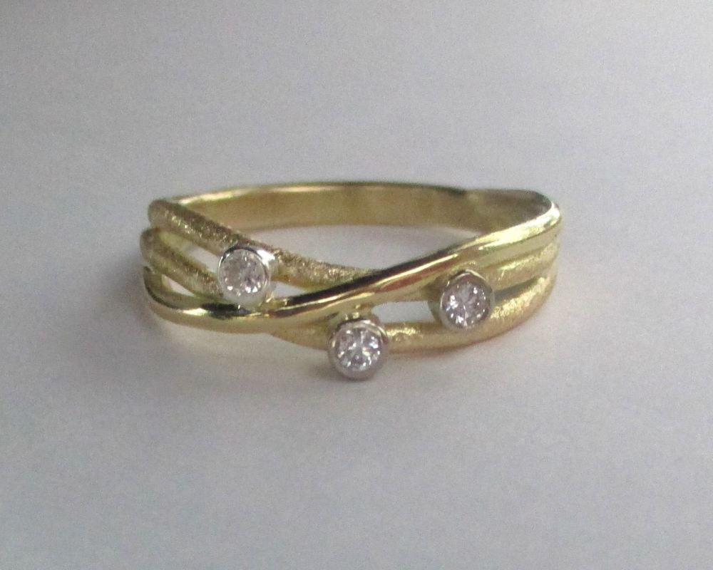 Shaped wedding rings: 18ct yellow gold and diamond set 'Slim Squiggle Ring'