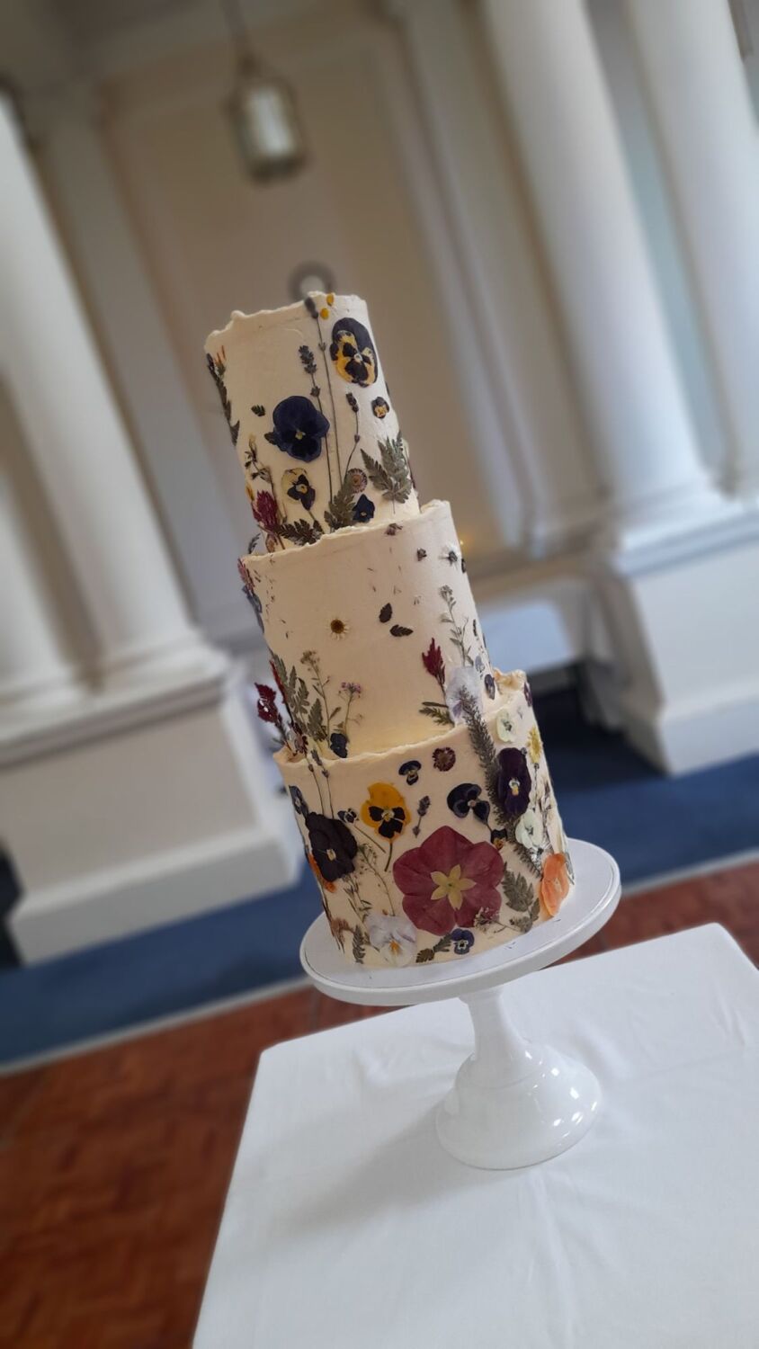 Pressed flower wedding cake