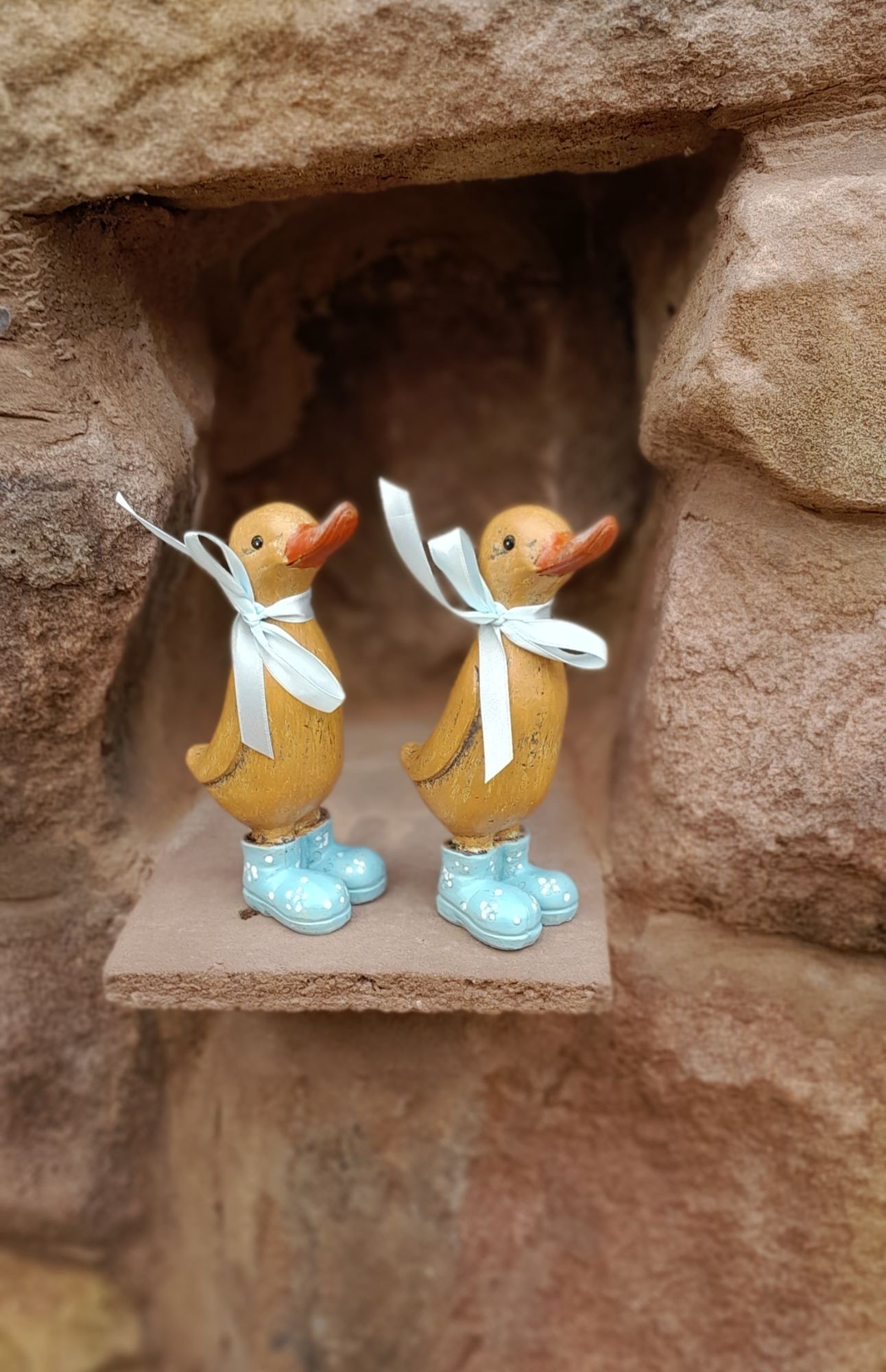 Wooden duck with blue spotted wellies and ribbon bow