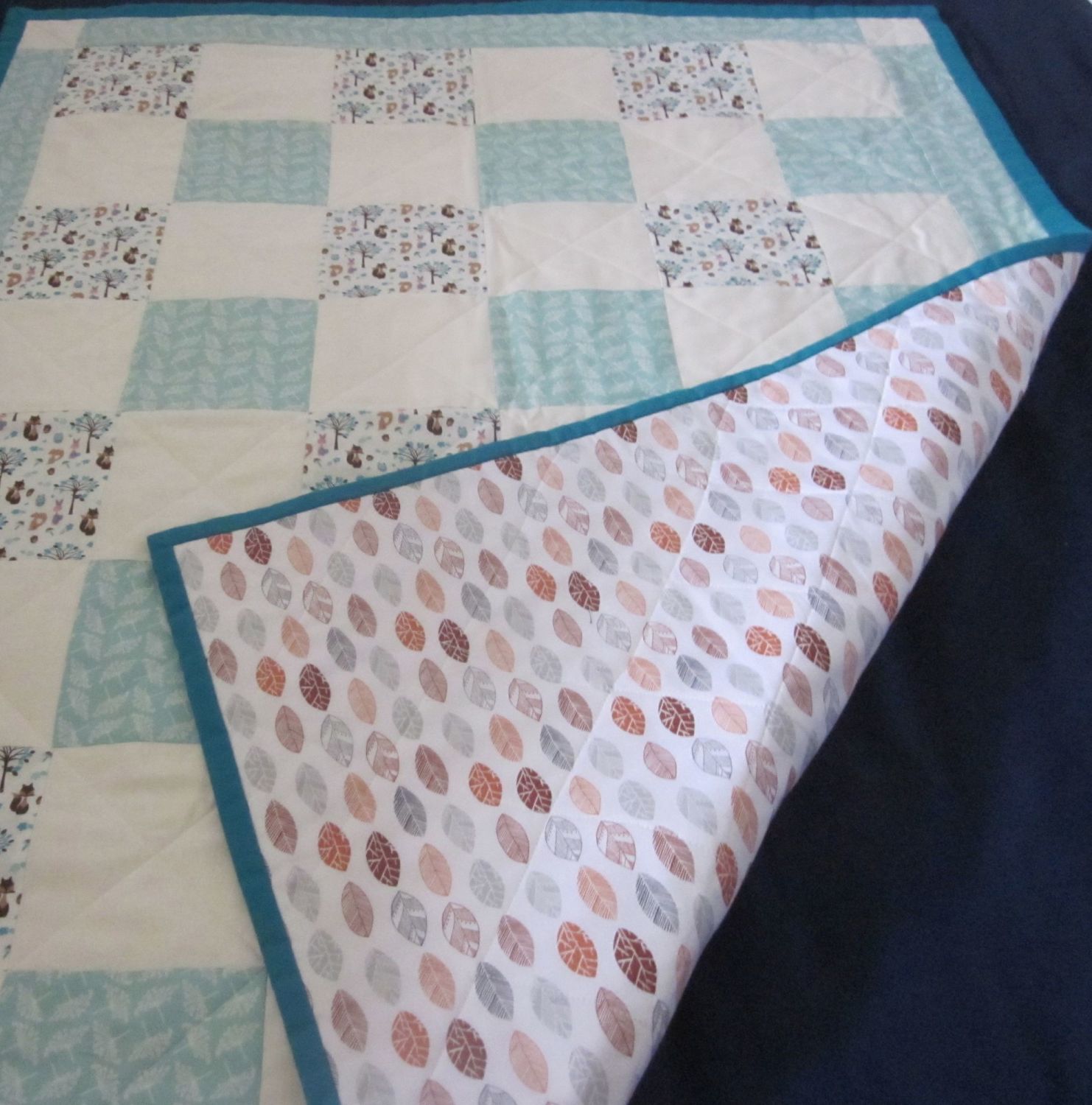 A custom patchwork baby quilt using a fox print from Fabric Freedom. A ...