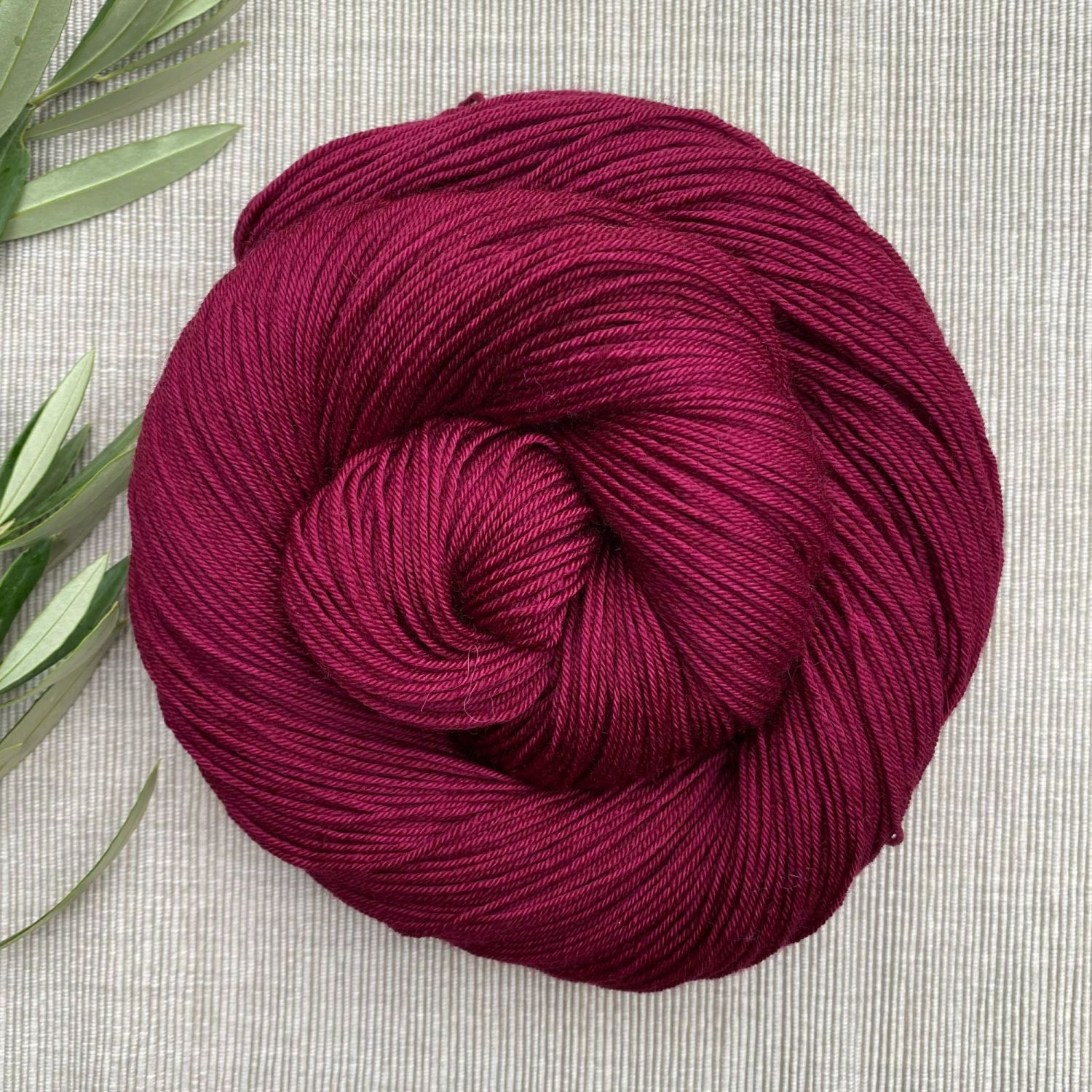 Red and colourful hand-dyed yarn