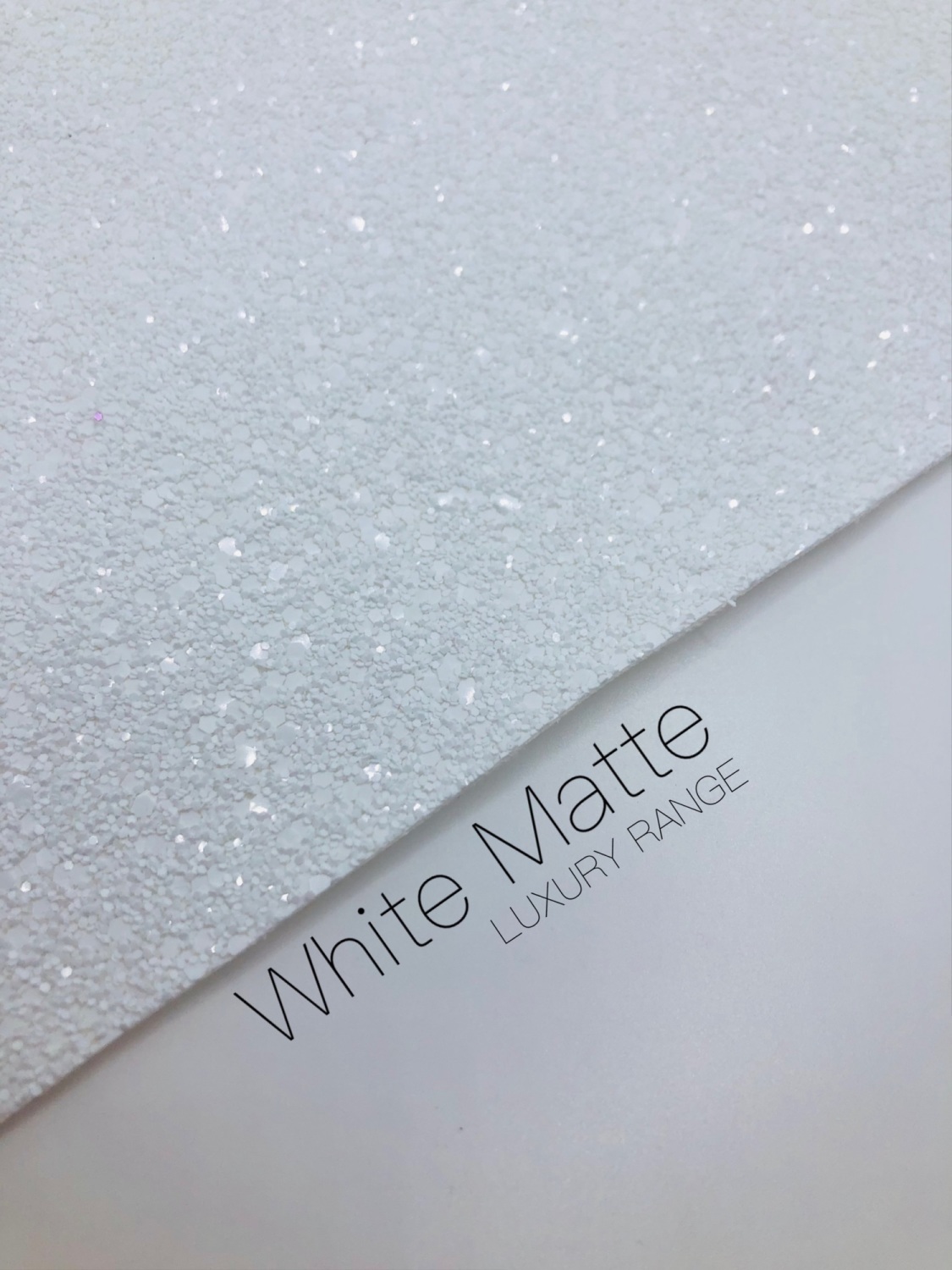 White matte luxury chunky glitter fabric